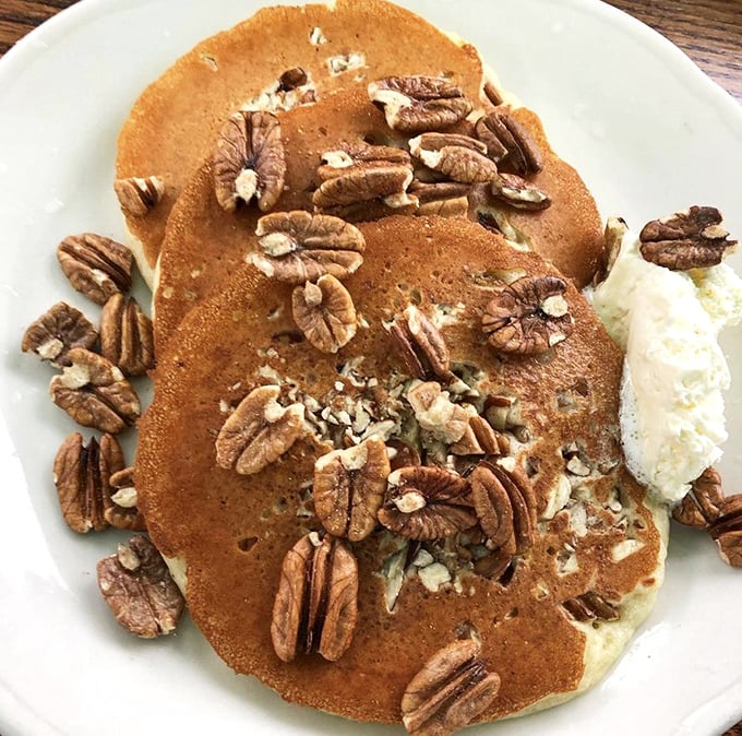 Pecan pancakes that strike the perfect balance between nutty crunch and fluffy cake – topped with a dollop of butter slowly melting into breakfast nirvana.