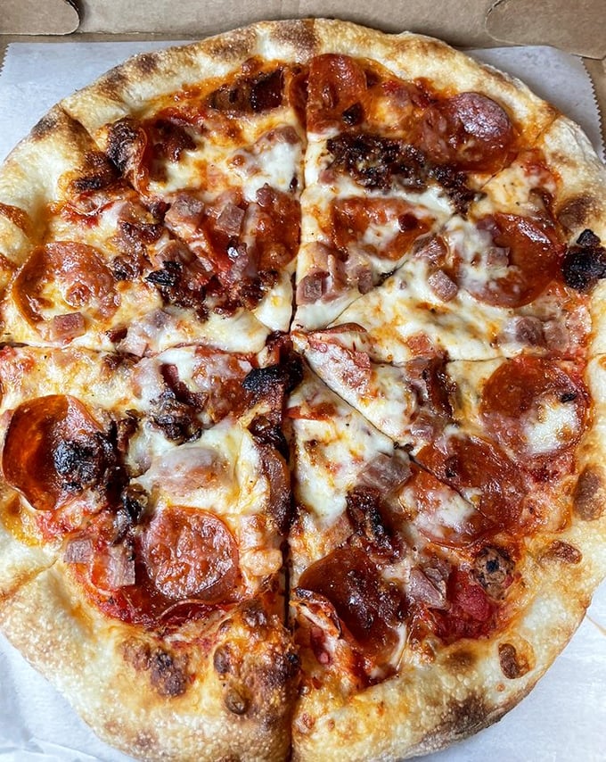 Pizza that proves bakeries can multitask. This pepperoni masterpiece shows what happens when bread experts decide to go circular and add toppings.