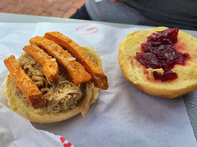 The pulled pork sandwich with sweet potato fries – proof that happiness doesn't need to be complicated, just served on a soft bun.
