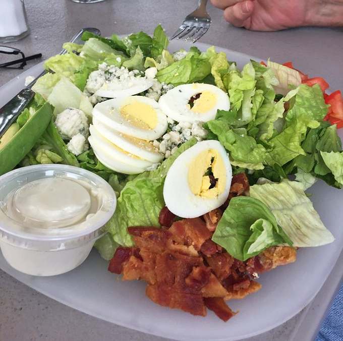 A salad that doesn't apologize for being healthy—it's too busy showing off its farm-fresh ingredients and perfectly boiled eggs.