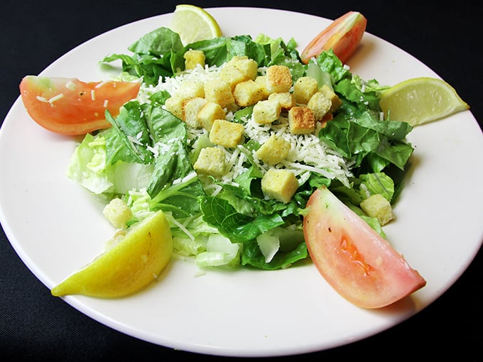 Even salad skeptics might be converted by this fresh arrangement of greens, tomatoes, and perfectly toasted croutons—a lighter option that doesn't sacrifice flavor.