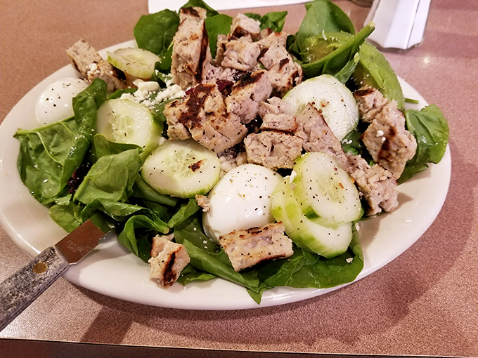 A salad that doesn't apologize for being healthy—it's too busy showing off its fresh ingredients and grilled chicken to care about your guilt.