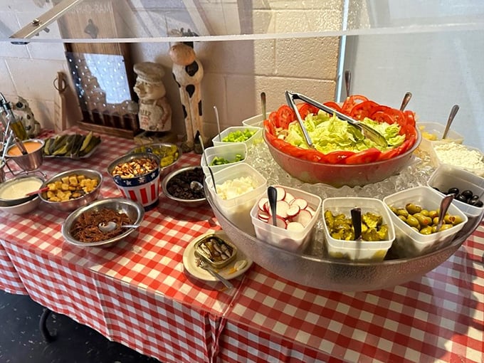 The salad bar—a humble spread of fresh ingredients waiting to become the prelude to your carnivorous symphony.