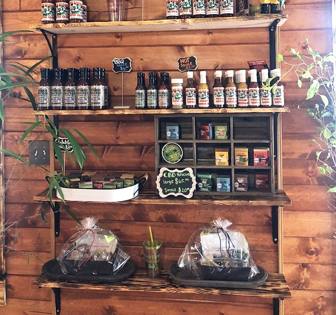 A wooden shelf stocked with local sauces and seasonings. Take home a taste of Florida—no fishing license required.