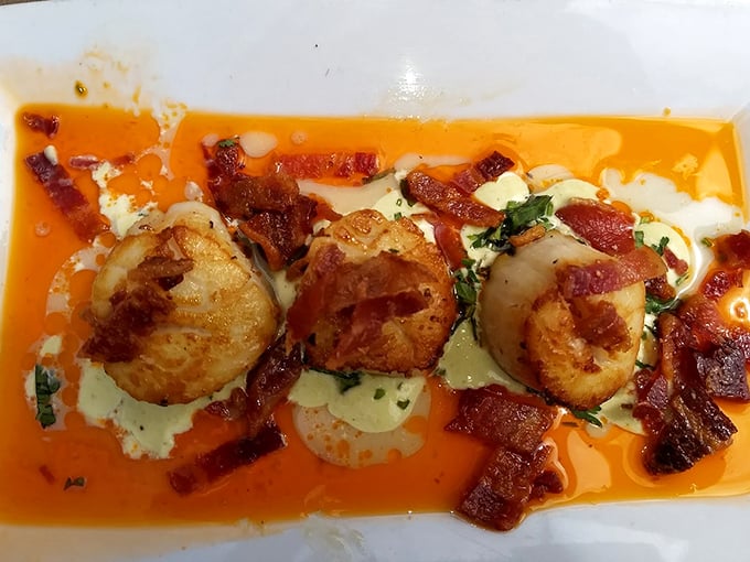 Scallops so perfectly seared they deserve their own Instagram account. That bacon and sauce combination is what food scientists would call "flavor nirvana."