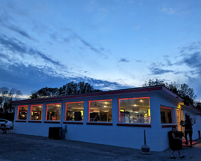 Checkered floors and neon lights give the concession building that perfect retro vibe – like stepping into a time capsule with snacks.