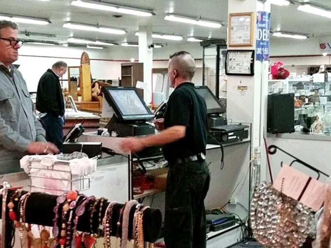 At the checkout counter, staff efficiently process the day's treasures. Their expertise keeps this secondhand symphony humming along.