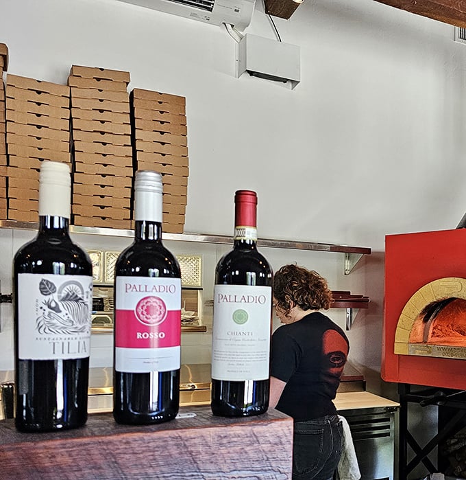 Behind every great pizza is a thoughtful selection of wines. These bottles aren't just decorative—they're waiting to elevate your meal.