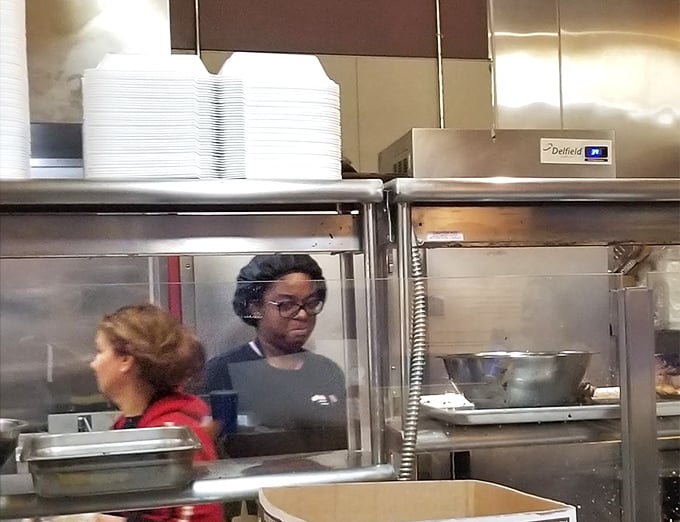 Where the magic happens. The kitchen team works with the focused precision of orchestra members during a symphony's crescendo.