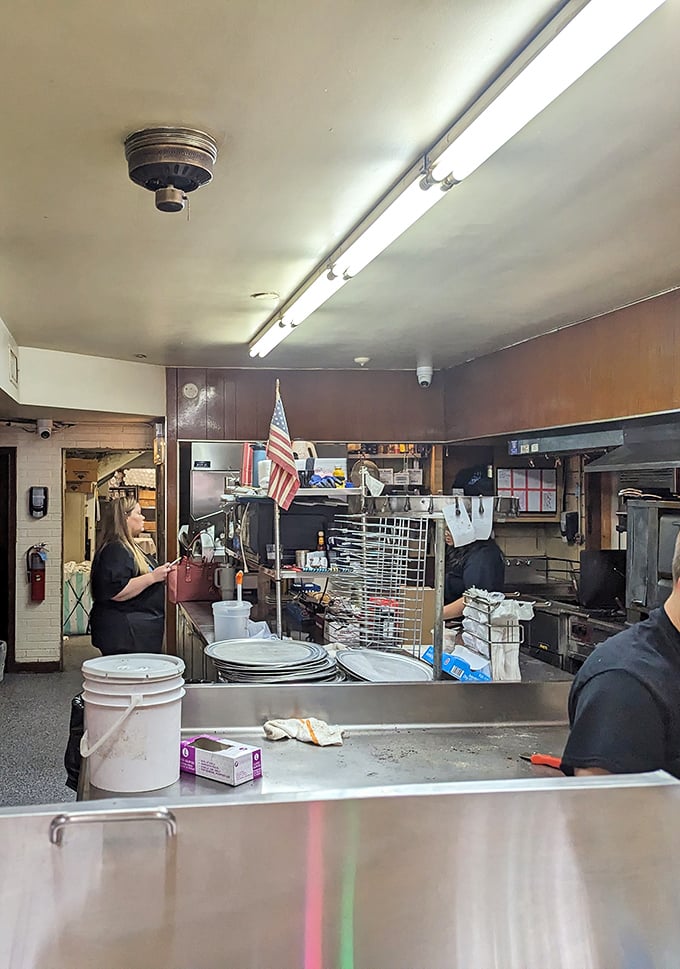 Behind every great pizza stands a team of dedicated professionals who've perfected their craft through decades of service.