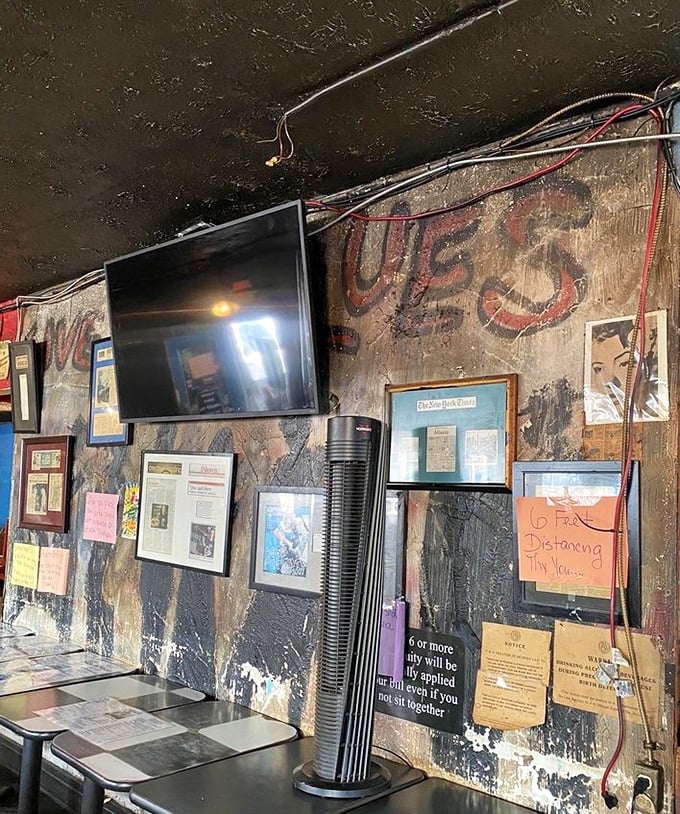The walls tell stories of BBQ triumphs past, while exposed wiring reminds you authenticity doesn't come in a neat package.
