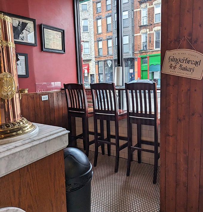 The window counter seating offers prime people-watching with your pastry. Three chairs, infinite possibilities for neighborhood connection.