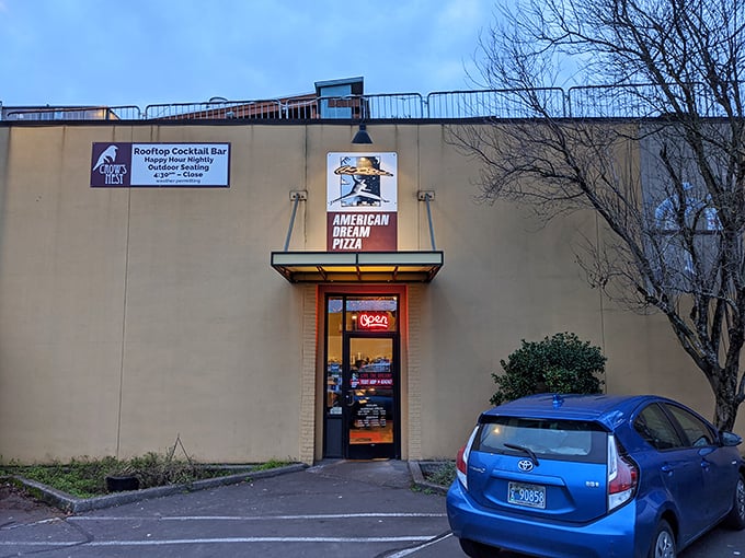 American Dream's bold yellow exterior and iconic slice sign is like a pizza lighthouse guiding the hungry to safe harbor.