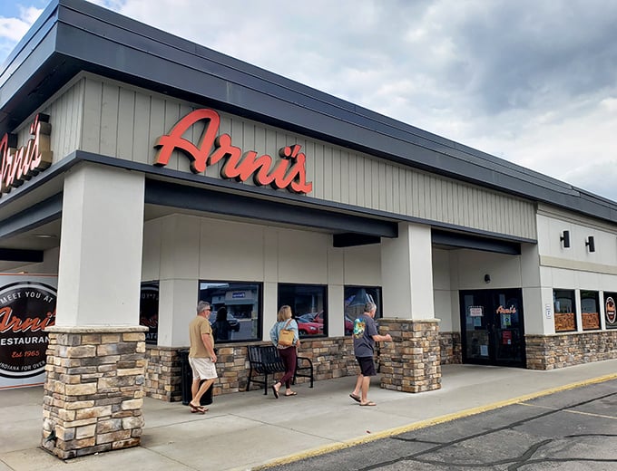 Arni's modern stone facade is like a poker face – never revealing the legendary thin-crust treasures waiting inside.