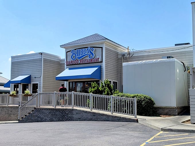 Bubba's clean white exterior with blue awnings looks like it was plucked from a coastal postcard – seafood with a view.
