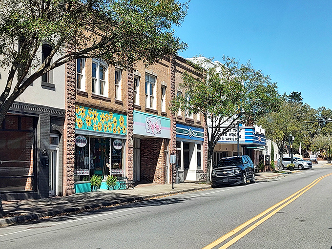Colorful storefronts line up like a cheerful parade of local businesses and friendly faces.