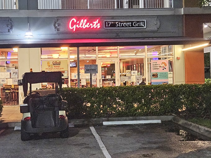 Gilbert's 17th Street Grill glows with neon promise. Behind those windows, burger magic happens daily.