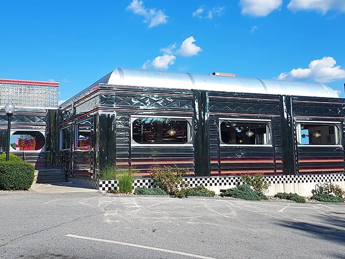 The Manheim Diner's polished exterior gleams under blue skies – like a silver bullet aimed straight at your hunger pangs.