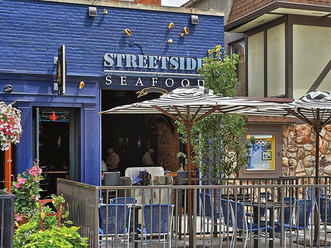 Streetside Seafood's vibrant blue exterior and outdoor seating create Birmingham's perfect summer seafood spot. Those umbrellas are calling my name!