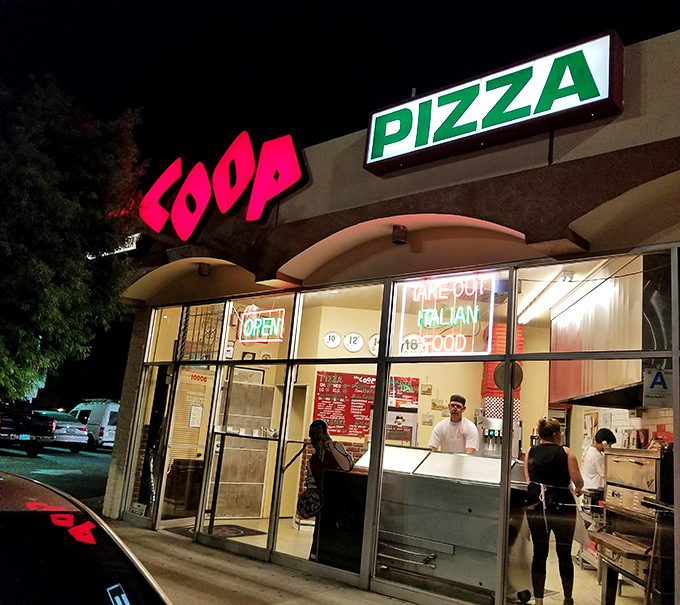The Coop's bold red sign promises Detroit-style pizza worth crossing town for. Those caramelized cheese edges are the stuff of dreams.