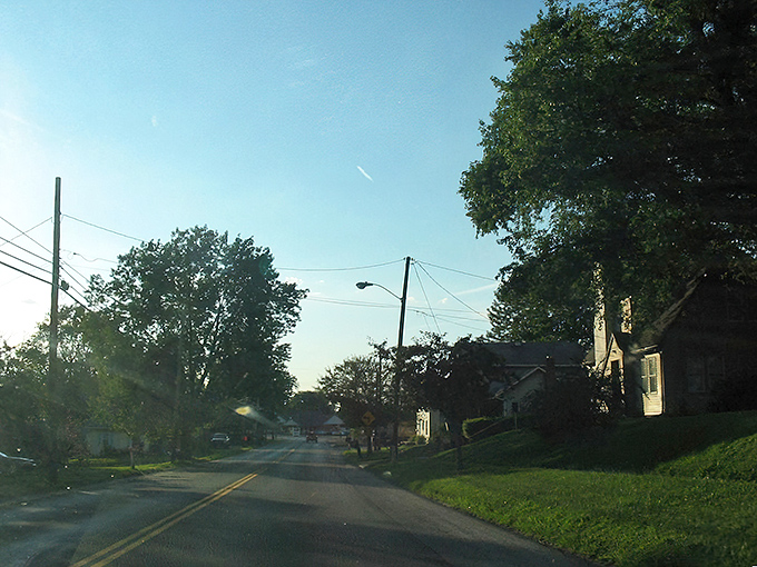 Golden hour glory! The setting sun bathes this small town in warm light, turning an ordinary scene into something magical. 