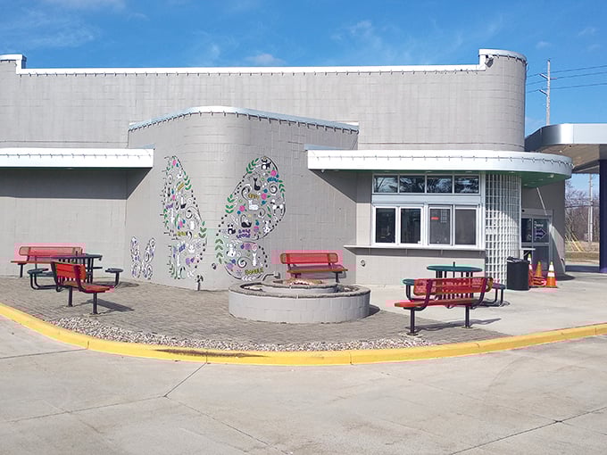 The butterfly mural and red picnic tables at Doodle create an outdoor dining room that no interior designer could improve upon.
