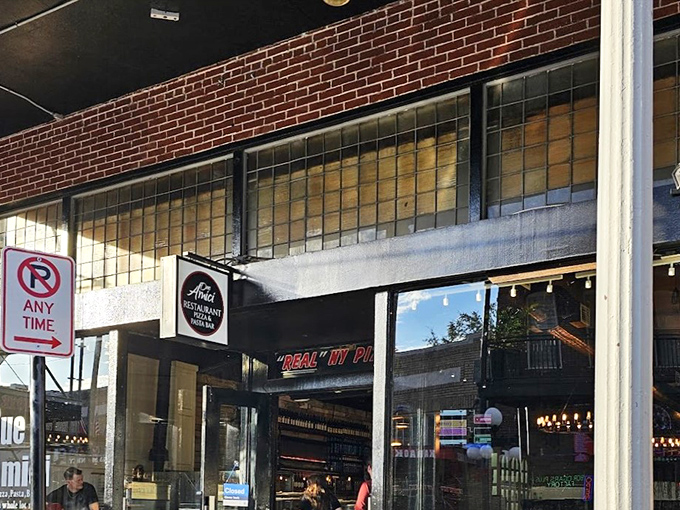 Due Amici: Classic black storefront with a hint of old-world charm. Pizza authenticity doesn't need flashy advertising.