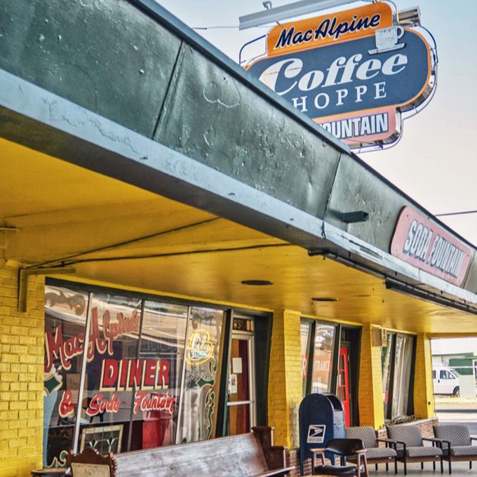 That retro "Coffee Shoppe" sign isn't just decoration – it's a portal to a time when soda jerks were artists and calories didn't count.
