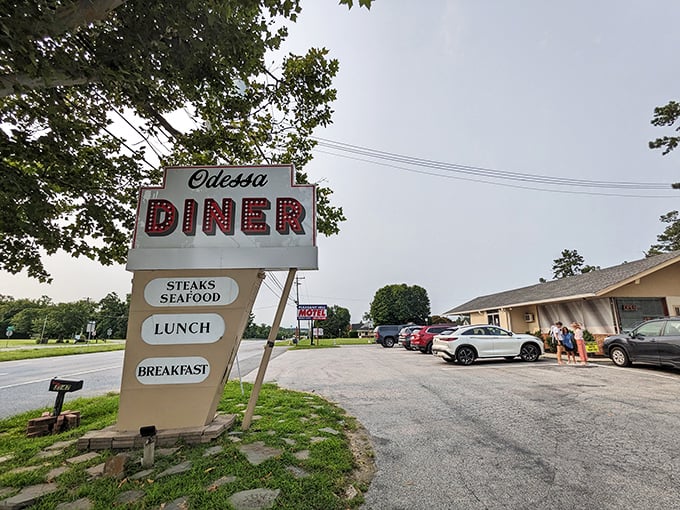 That classic diner sign with its bold red letters makes a promise that the kitchen inside keeps with every plate of home-cooked goodness.