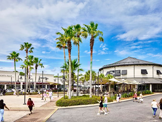 Palm trees sway as shoppers play at Silver Sands, where outlet shopping comes with a refreshing side of coastal breeze.