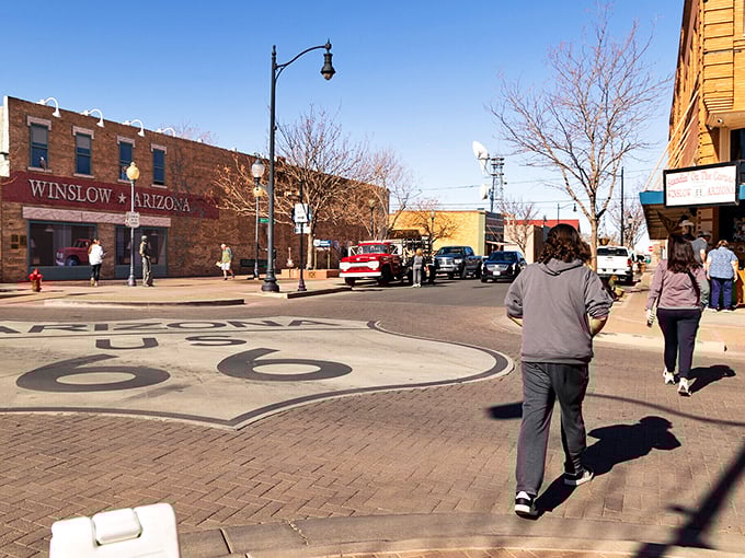 The Route 66 emblem embedded in Winslow's sidewalk reminds us that sometimes the journey matters more than the destination.