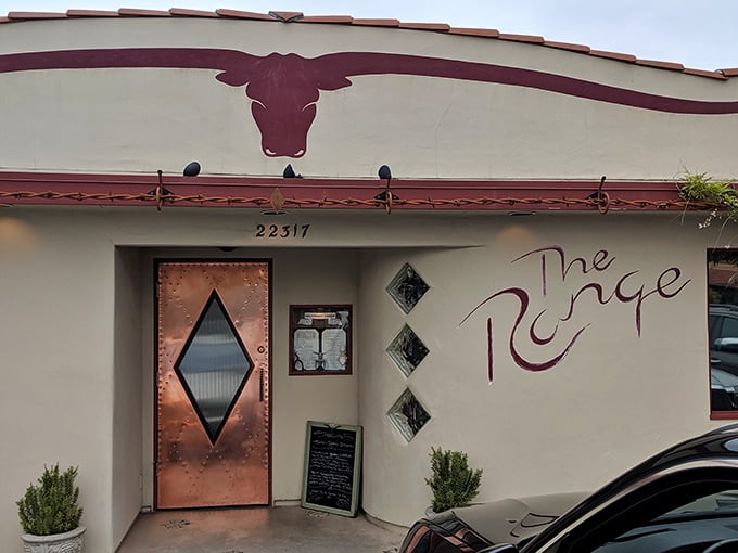The iconic bull silhouette and copper diamond door welcome hungry travelers to this unassuming culinary oasis in tiny Santa Margarita.
