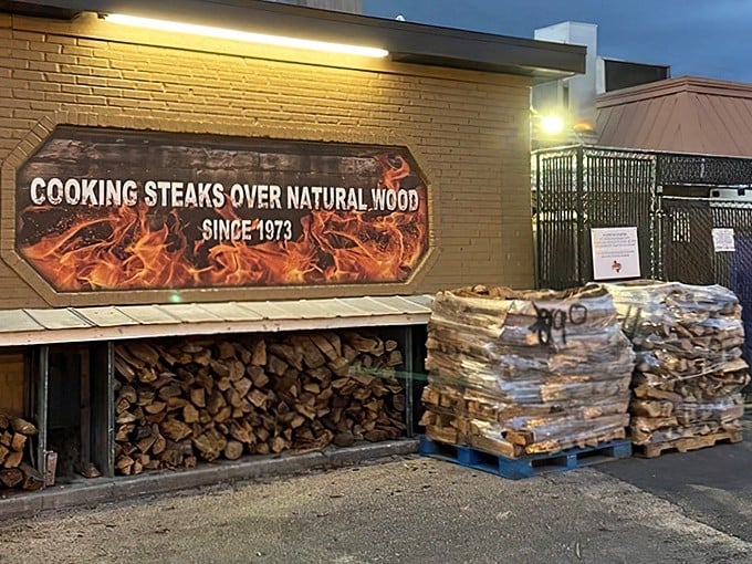 The proof is in the piles! Stacks of oak firewood aren't just decoration—they're the secret behind those perfectly smoky steaks since 1973.
