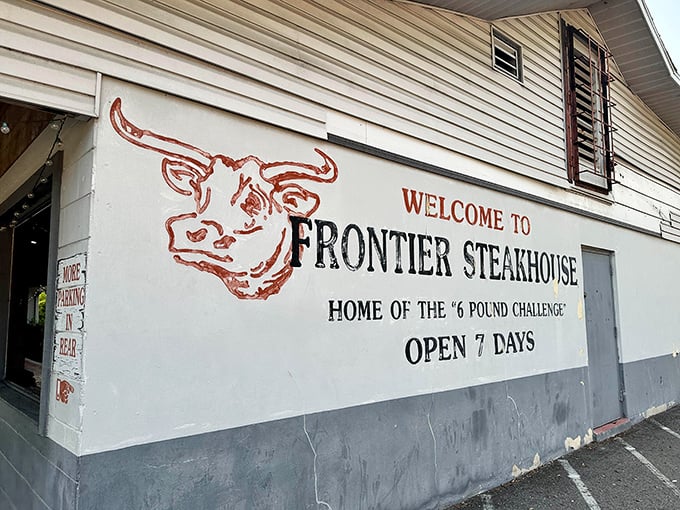 The unassuming exterior of Frontier Steakhouse boldly announces its "6 Pound Challenge" like a carnivore's Everest waiting to be conquered. Pure Florida steakhouse confidence.