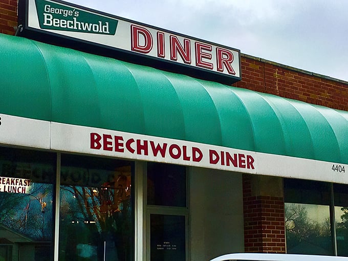The classic brick exterior with vibrant greenery says it all—this place may not be fancy, but it promises a fantastic experience.