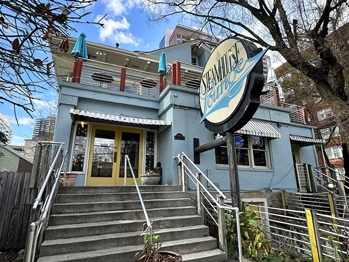 The light blue exterior with cheerful yellow accents feels like a coastal secret hiding in plain sight in Atlanta's urban landscape.