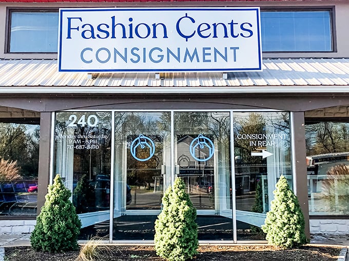The welcoming storefront of Fashion Cents beckons with its clean lines and neatly trimmed shrubs—like a retail oasis promising treasures within.