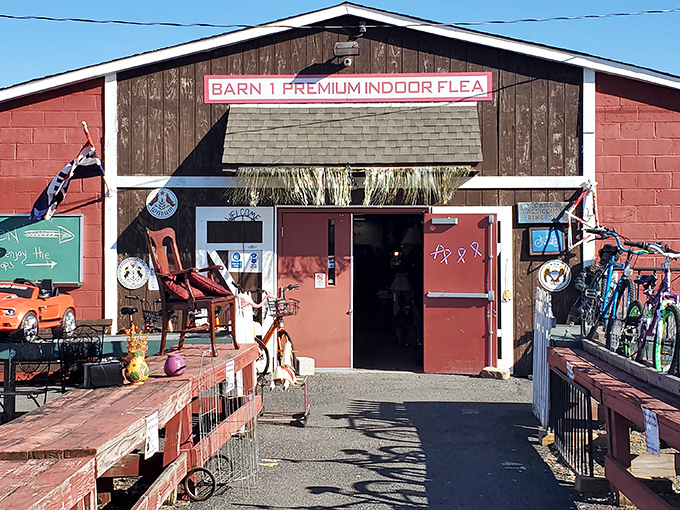 Barn 1's rustic entrance beckons treasure hunters with the promise of vintage finds and unexpected discoveries hiding just beyond those red doors.