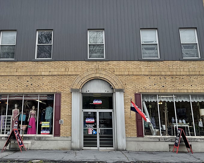 The classic yellow brick façade of Our Town Boutique beckons with the promise of hidden treasures behind its arched entrance.