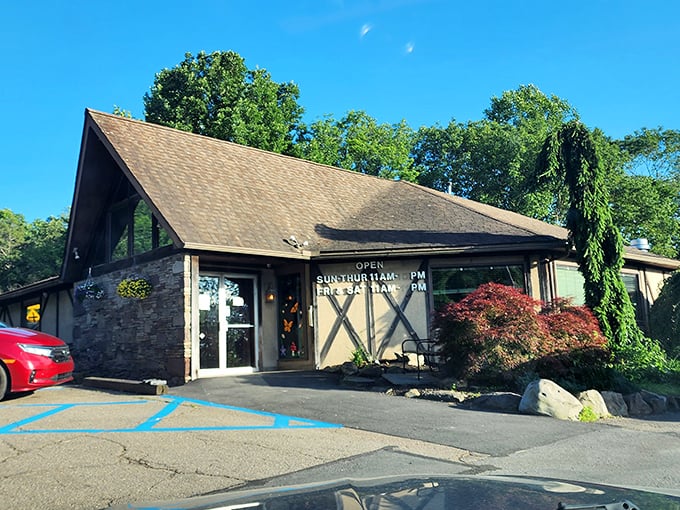 The A-frame charm of The Fireplace Restaurant stands like a rustic beacon for hungry travelers. Those barn-style X's aren't just for show—they're signaling "X marks the spot" for prime rib treasure.