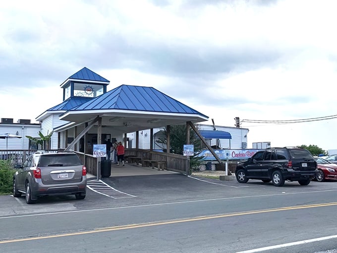 The iconic blue-roofed entrance to Captain Billy's welcomes seafood pilgrims like a maritime lighthouse guiding hungry souls home.