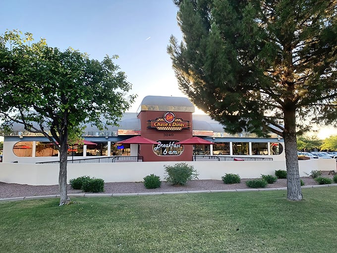 The classic red and white exterior of Chase's Diner glows invitingly against the Arizona sky, like a beacon of comfort food paradise.