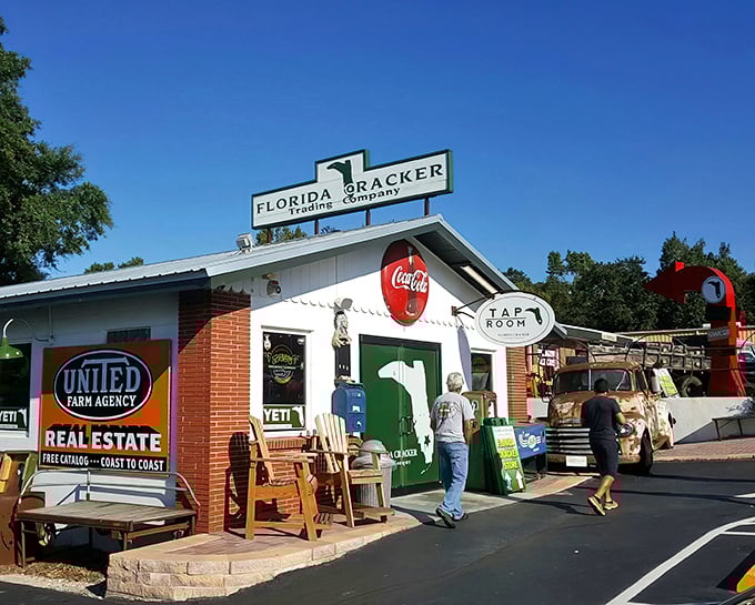 The humble exterior of Florida Cracker Kitchen beckons with rocking chairs and that iconic green door—like a friend's porch that happens to serve incredible food.