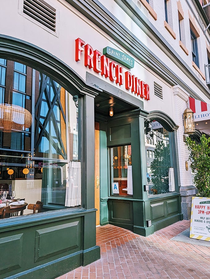 That neon sign isn't just illuminating the street—it's beckoning you into a Franco-American love affair that starts with your eyes and ends with your stomach.