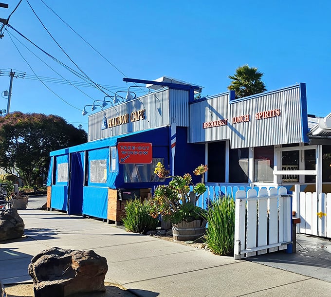 Harbor Cafe's cheerful blue exterior stands like a beacon of breakfast hope against the Santa Cruz sky, promising culinary adventures within.