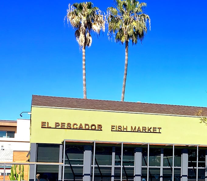 The iconic lime-green exterior with twin palm trees standing guard is La Jolla's seafood beacon, calling to fish lovers from miles around.