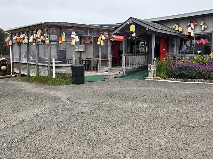 Another angle reveals the full character of this coastal treasure—where fishing floats and weathered boards tell stories of decades facing the Pacific elements.