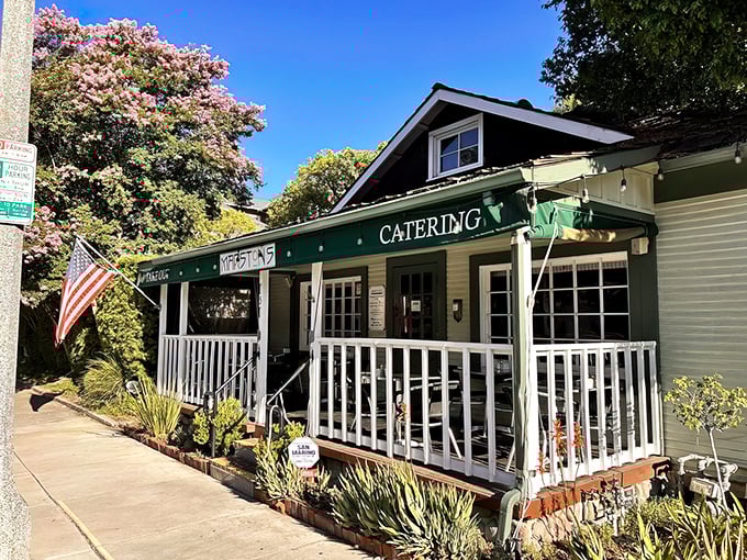 A charming Craftsman bungalow transformed into breakfast paradise, Marston's welcomes you with a white picket fence and American flag—home before you even walk in.