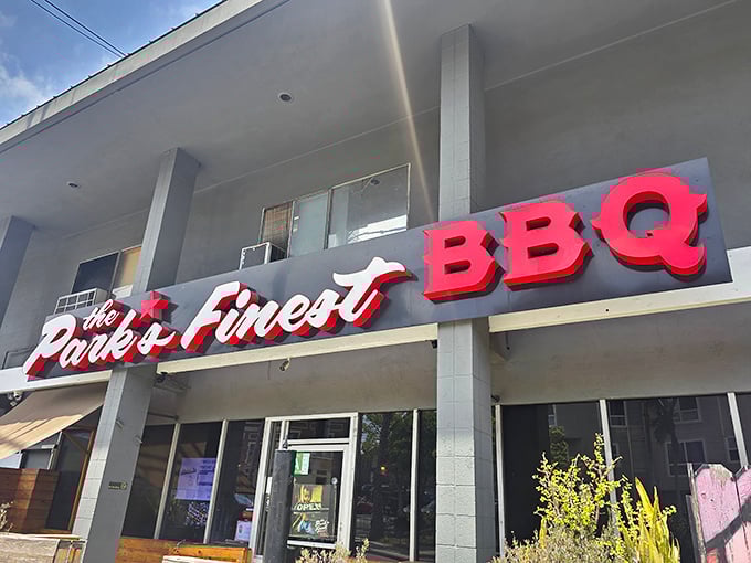 The bold red signage of The Park's Finest BBQ beckons like a beacon to hungry souls wandering Echo Park. No frills, just promises of smoky delights within.