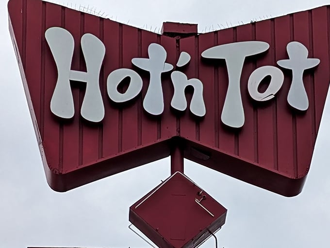 That retro sign isn't just decoration—it's a time machine. Hot N Tot's distinctive bowtie logo has been guiding hungry travelers to breakfast nirvana for generations.